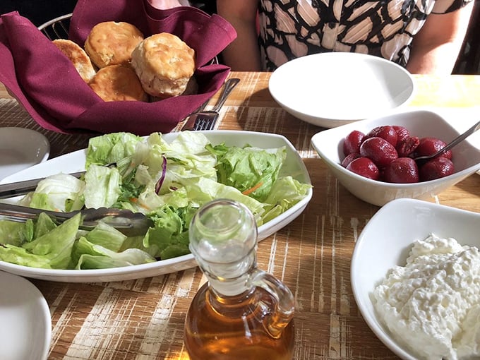 The meal begins with fresh salad, pickled beets, and biscuits&mdash;a prelude that would be the main event anywhere else.