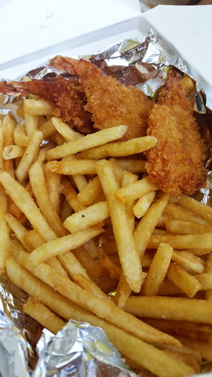 Golden-fried shrimp standing at attention alongside crispy fries&mdash;proof that Michael's seafood game is just as strong as their beef.