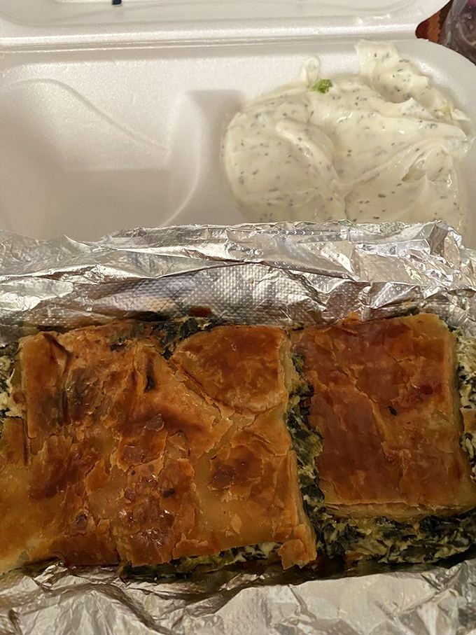 Golden, flaky spanakopita squares that shatter with each bite, paired with tzatziki so creamy it deserves its own fan club.