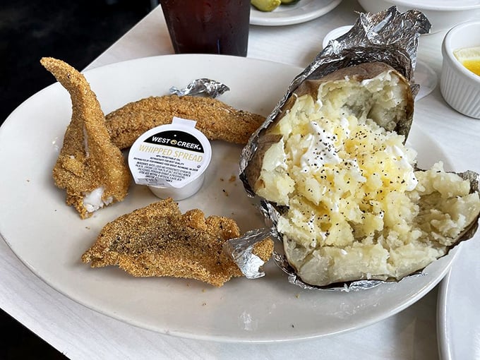 A baked potato wrapped like a present, because sometimes the best gifts come wrapped in foil, not fancy paper.