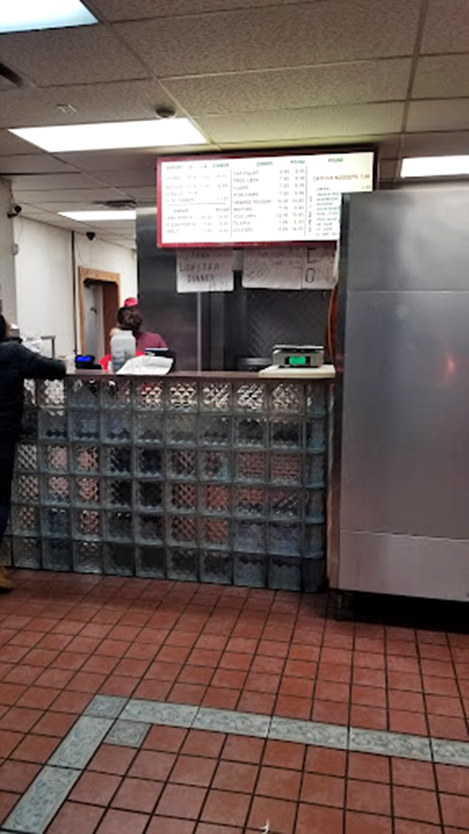 Where the magic happens: the ordering counter where dreams of perfectly fried seafood begin their journey to reality.