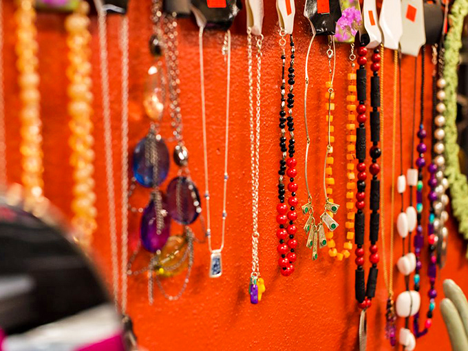 Neck and neck in the accessory race! This dazzling display of necklaces is like a wearable rainbow, perfect for jazzing up any outfit.