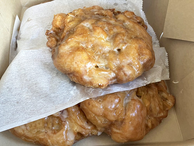 Apple fritter archaeology: layers of pastry and fruit waiting to be discovered, glazed evidence that bakers here understand the importance of morning indulgence.