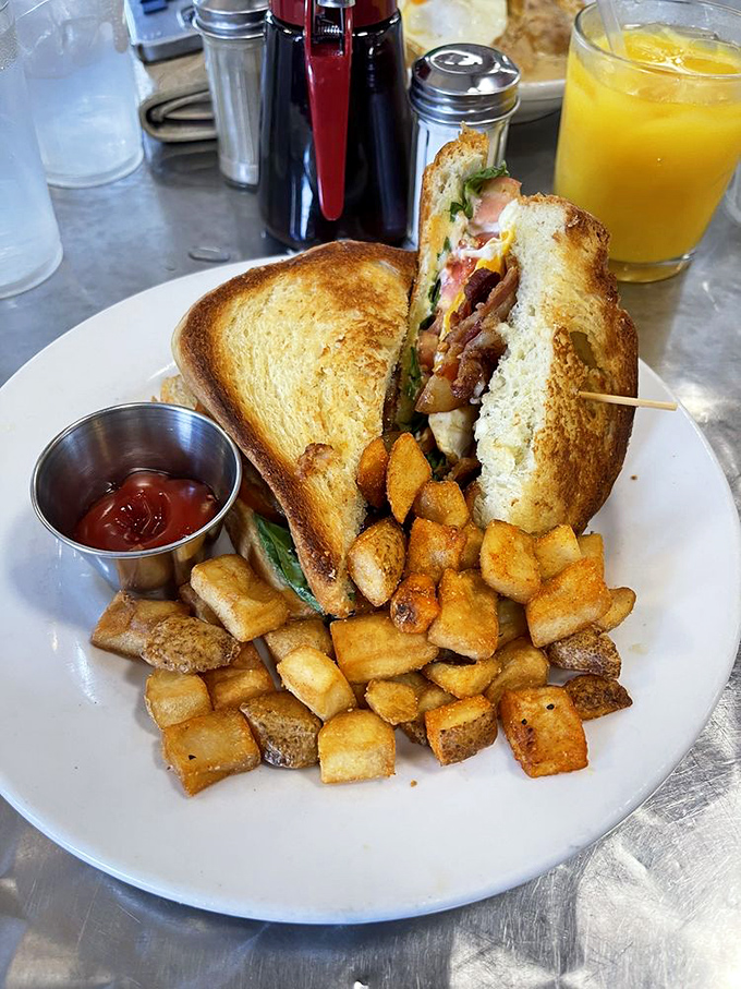 This sandwich isn't just stacked—it's architecturally sound. Golden toast holding together a masterpiece that makes lunch the meal to beat.