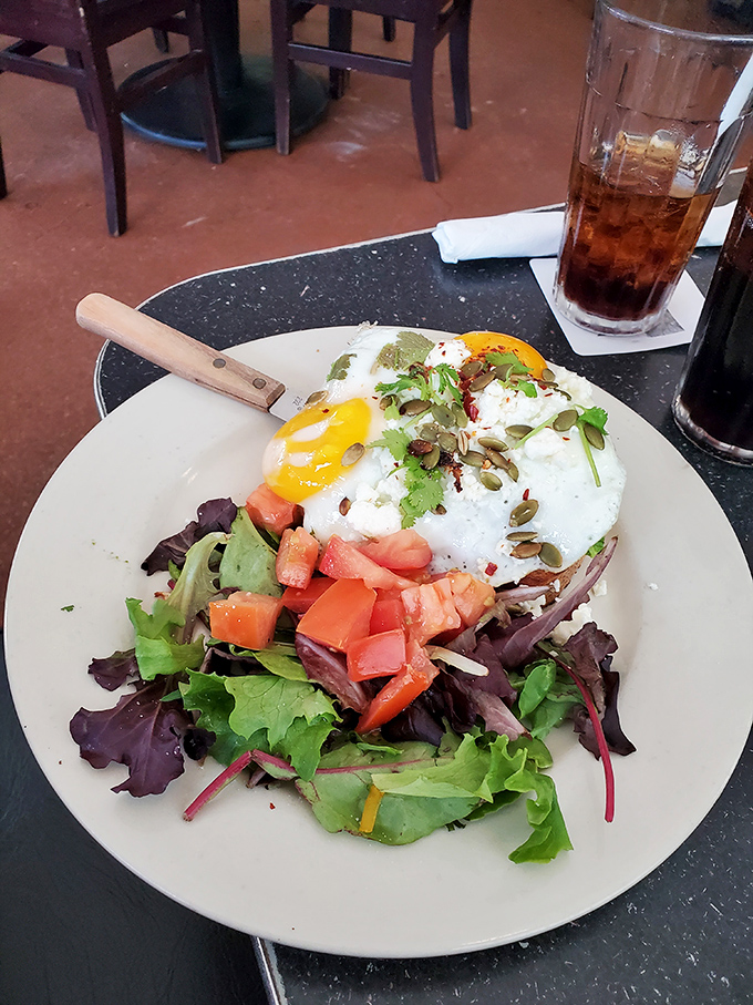 Garden-fresh greens topped with a perfectly poached egg and vibrant tomatoes. Healthy eating never looked so tempting.