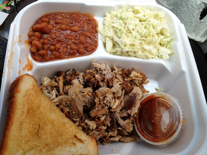 The BBQ plate with its trinity of meat, beans, and slaw represents the kind of balanced meal that grandparents approve of and grandkids secretly love.