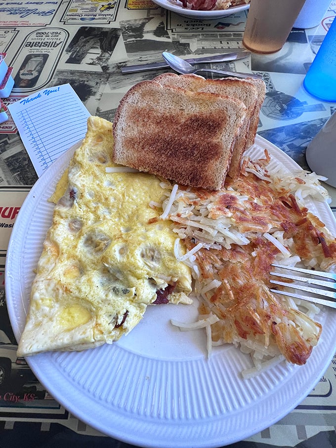 This omelet has seen things. Filled with enough bacon to make you consider vegetarianism tomorrow – but definitely not today.