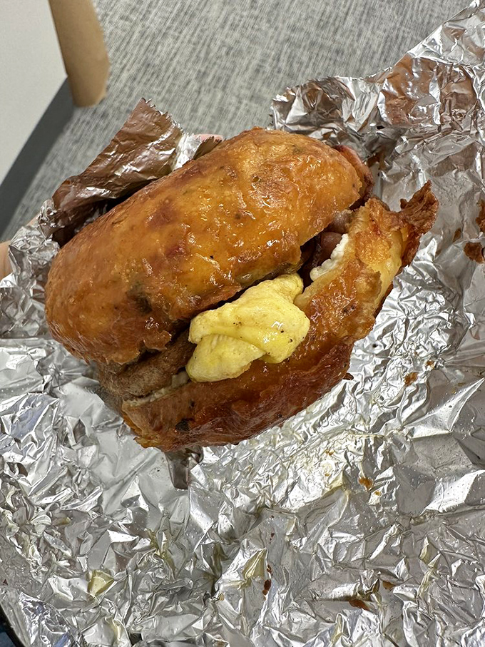 Breakfast sandwich nirvana: eggs and cheese nestled in a golden-fried donut. Where sweet meets savory, magic happens.