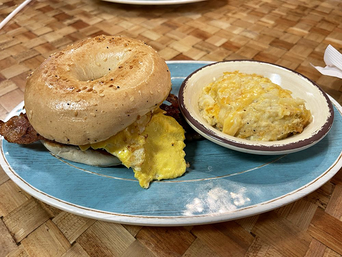 Breakfast doesn't need to be complicated—a freshly baked bagel, fluffy scrambled eggs, and a side of cheesy potatoes prove that sometimes simpler is tastier.