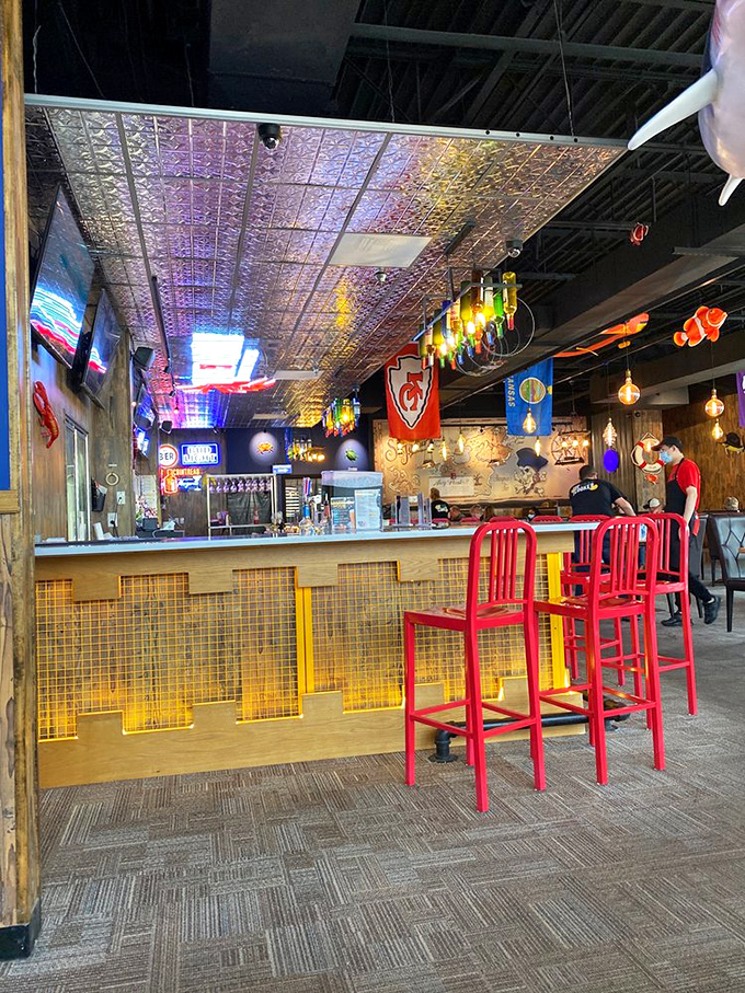 The bar area glows with promise, those red chairs practically shouting, "Sit here and tell us about the one that got away!"