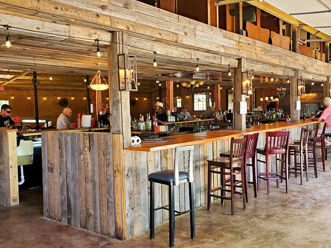The bar area blends rustic charm with Oklahoma hospitality, proving that wood paneling never really went out of style when it's this authentic.