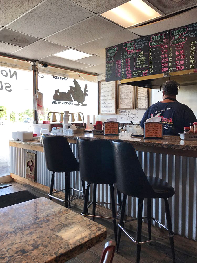 The counter area with its corrugated metal front says, "We're serious about chicken, not about fancy interior design."