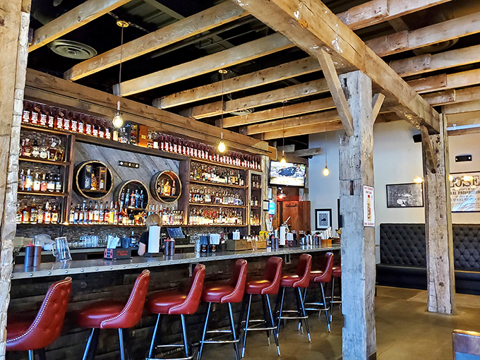 The bourbon selection behind the bar isn't just impressive&mdash;it's educational. Those wooden beams weren't just for show; they're holding up generations of whiskey wisdom.