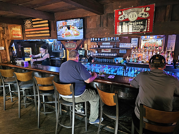 The bar gleams with bottles promising liquid courage for those preparing to tackle portions that could feed a small ranch.