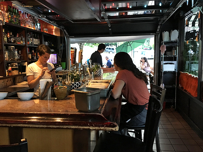 The bar area feels like the neighborhood's living room, where regulars perch and newcomers quickly become friends over house-made aguas frescas or something stronger.