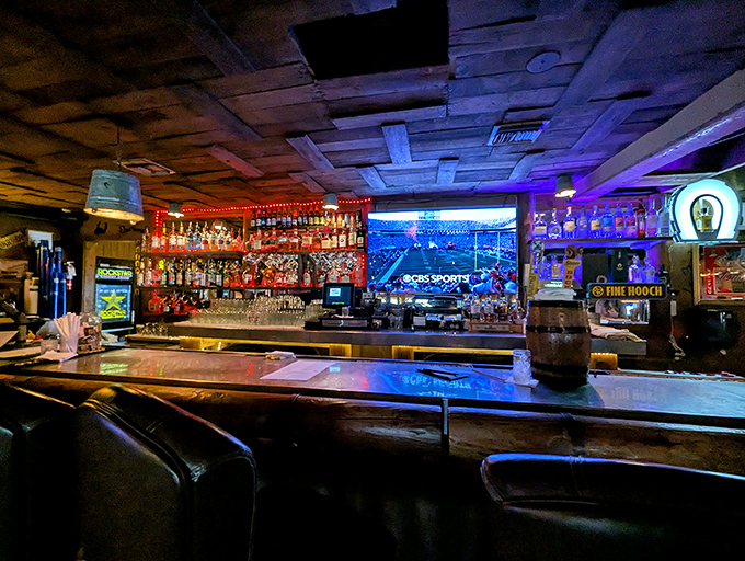 A bar where Western rustic meets neon glow, creating the perfect backdrop for telling tall tales that get taller with each round.