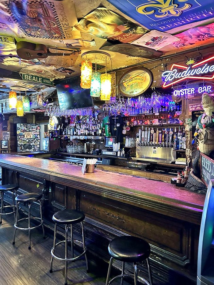 The bar gleams with promise beneath a ceiling decorated with memorabilia. This is where libations are crafted with the same care as the kitchen's creations.