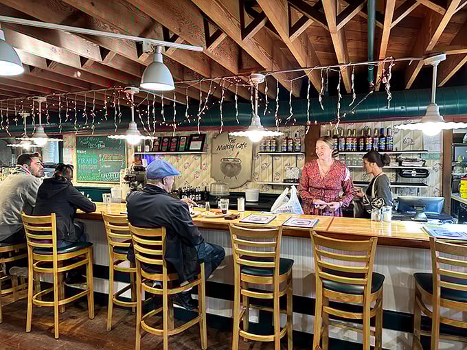 The counter seating offers front-row tickets to the breakfast theater, where every plate that emerges is more impressive than the last.