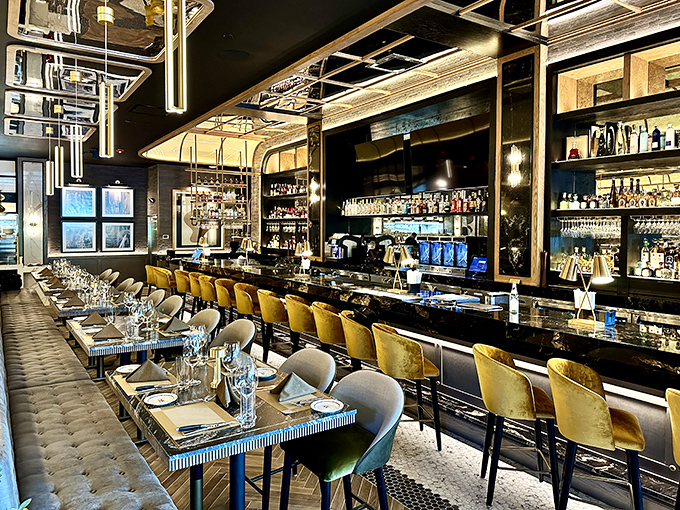 The bar beckons with golden accents and the promise of perfectly crafted cocktails&mdash;the ideal prelude to the main event.