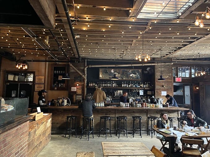 The bar area's warm glow promises liquid companionship for your meat journey &ndash; bourbon and brisket being barbecue's power couple.