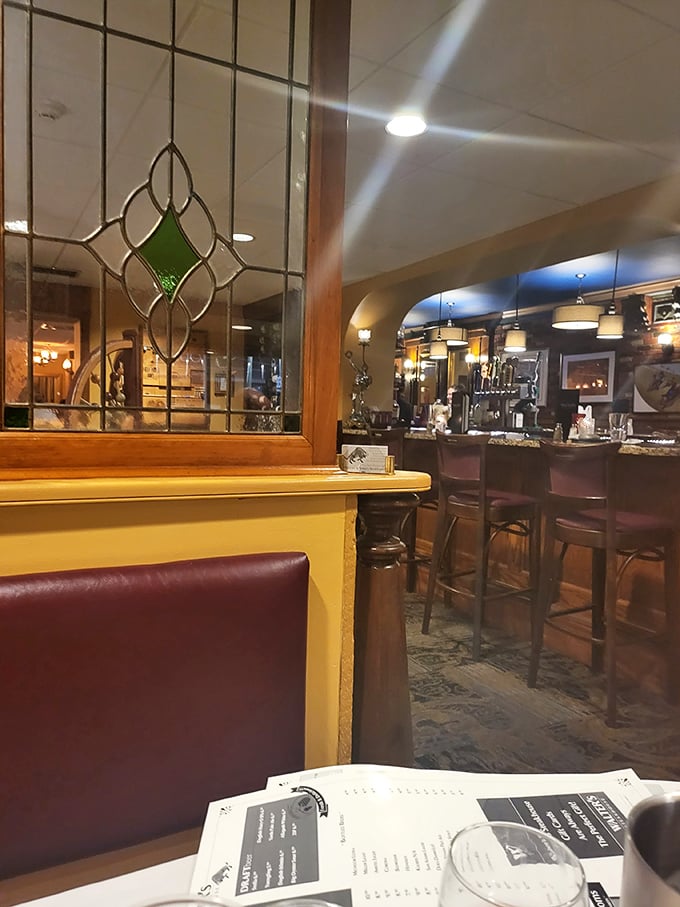 The stained glass divider adds old-world charm to the bar area&mdash;where many great evenings at Walter's begin and end.