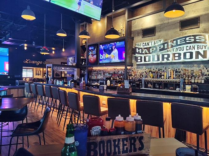 "You can't buy happiness but you can buy bourbon" proclaims the sign above a bar that clearly understands the fundamentals of human joy.