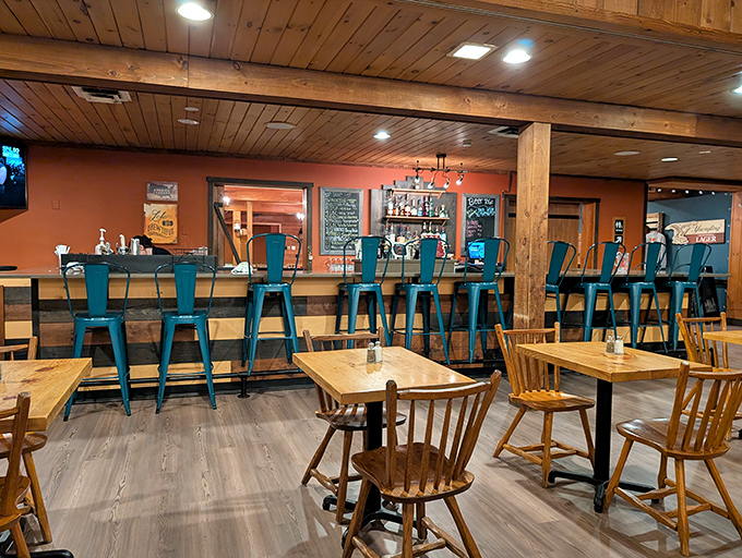 The bar area beckons with turquoise stools that pop against warm wood tones&mdash;a perfect perch for barbecue contemplation.