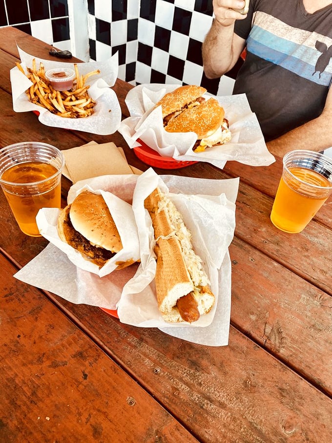 A wooden table that's seen thousands of meals, beers that need no explanation, and food that makes conversation pause mid-bite.