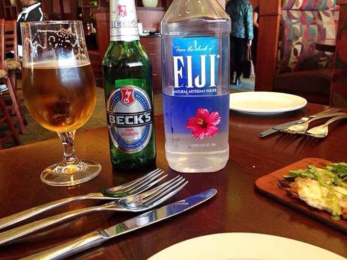 Sometimes the perfect dining companion is simply a cold Beck's, a bottle of Fiji, and the promise of good food on the horizon.