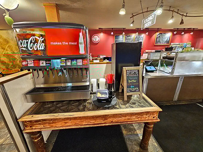 The soda fountain station: where your beverage decision is the easiest choice you'll make all day. That rustic wooden table has seen things.