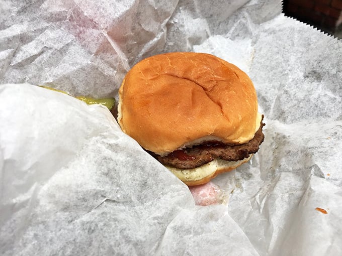 Wrapped in paper like the humble gift it is, this no-frills burger has satisfied late-night cravings and midday hunger pangs for nearly a century.