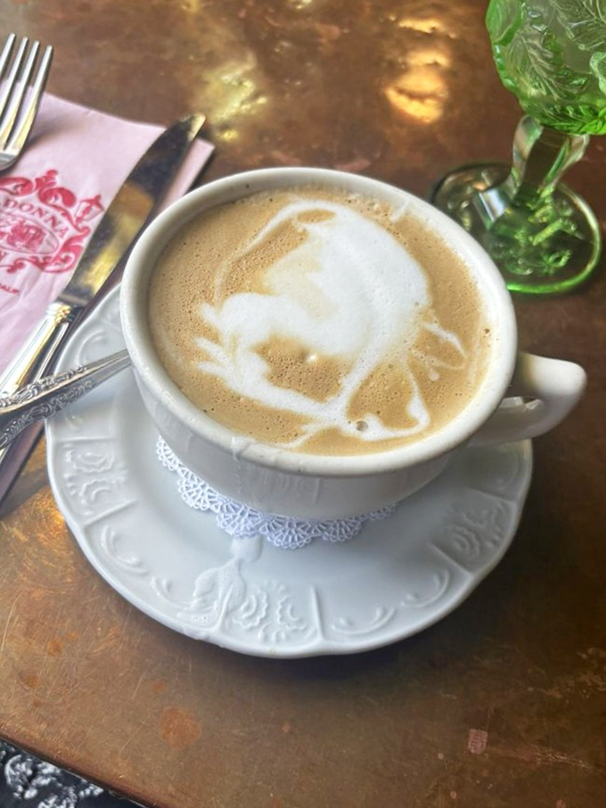 Latte art so pretty you almost don't want to drink it. Almost. That foam leaf is practically begging for its Instagram moment.