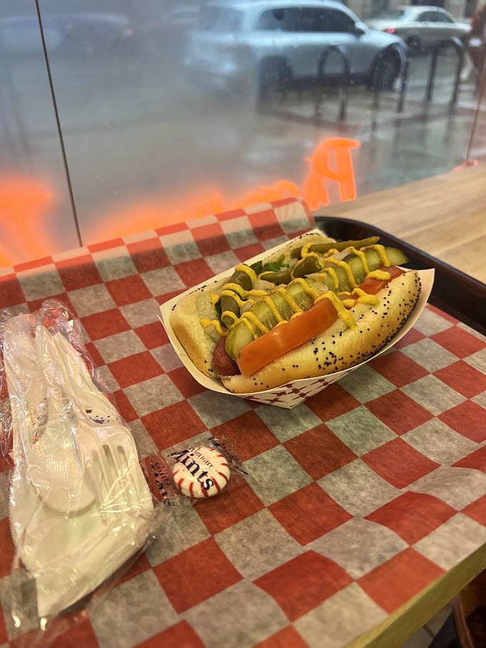 The Chicago dog in its natural habitat &ndash; a symphony of toppings in perfect harmony on a poppy seed bun, demanding your full attention.