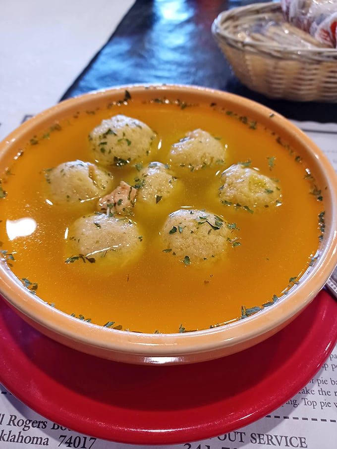 Matzo balls floating in golden broth like delicious dumplings from heaven. Soul-warming soup that transcends cultural boundaries.