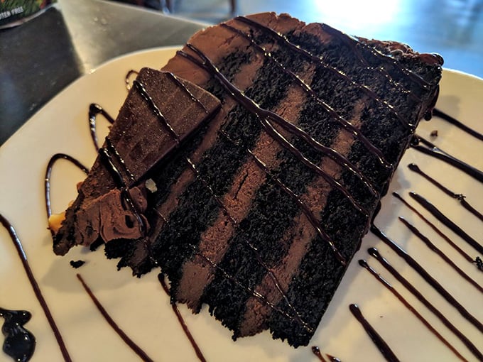 A chocolate cake so rich it probably owns beachfront property. Each decadent layer is like a chapter in a story you never want to end.