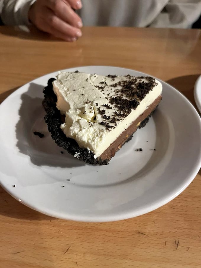 A slice of chocolate pie that makes you want to write love poems, call your mother, and order another piece immediately.