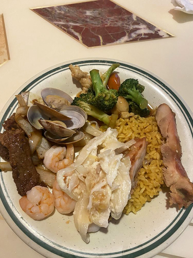 Fresh clams join the seafood party alongside shrimp and fish, proving this buffet takes its ocean offerings seriously.