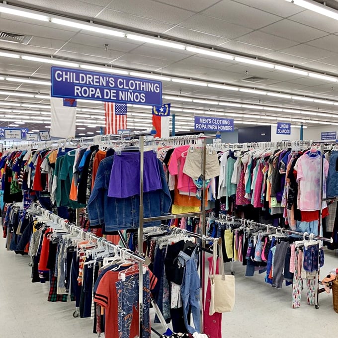 The children's clothing section is meticulously organized with bilingual signage, making it easy for parents to find quality garments at budget-friendly prices.
