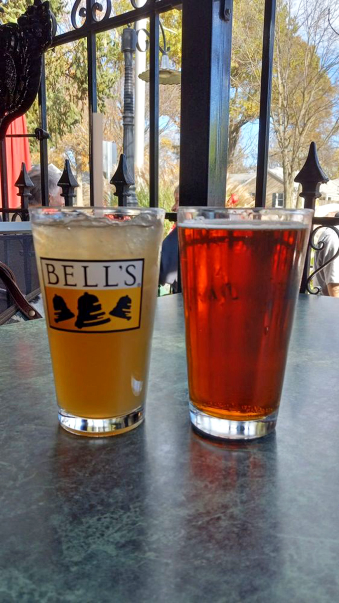Two craft beers enjoying the outdoor patio. One golden, one amber &ndash; like liquid sunshine and sunset in glassware.