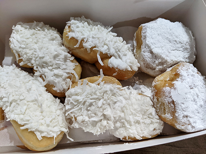 Coconut-covered treasures nestled beside powdered classics&mdash;a tropical vacation and a snow day in one delightful box. Textural paradise awaits.