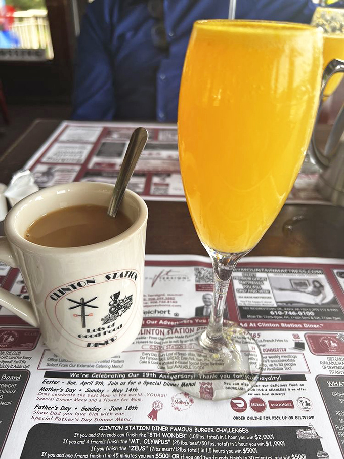 Morning decisions: caffeine for survival, mimosa for joy. The Clinton Station mug suggests you're among friends who understand.
