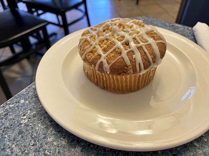 This isn't just a muffin&mdash;it's a cinnamon-kissed, icing-drizzled reason to skip the snooze button and get to L'Dees before they run out.