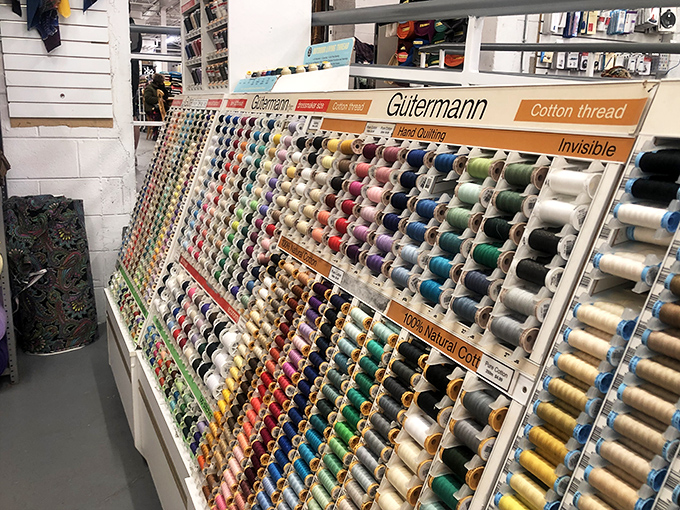 The thread wall&mdash;a textile artist's color wheel. Finding the perfect match here is more satisfying than completing a New York Times crossword puzzle.