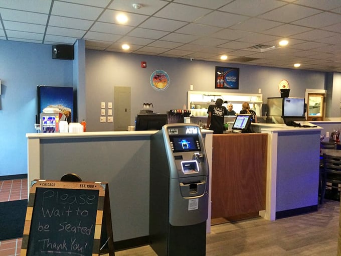 The "Please wait to be seated" sign might as well read "Prepare yourself for the burger experience that will ruin all other burgers for you."