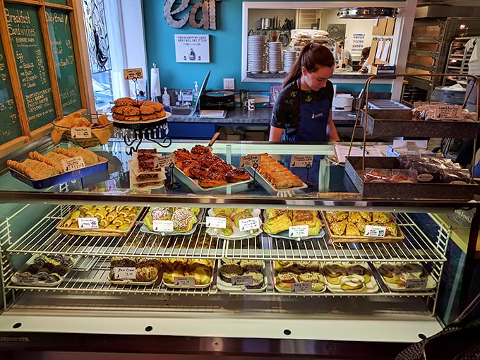 Behind this counter, pastry magic happens daily. Like Willy Wonka's factory, but with significantly fewer workplace accidents and more croissants.