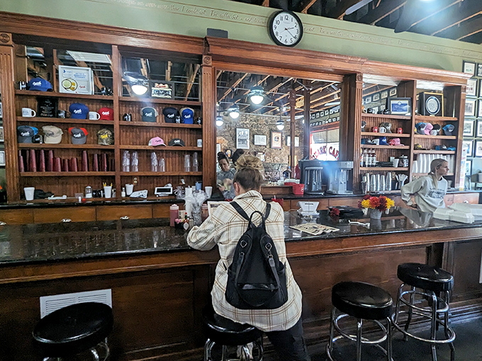 The counter offers front-row seats to the culinary show, where coffee cups are never empty and friendly banter flows as freely as the coffee.