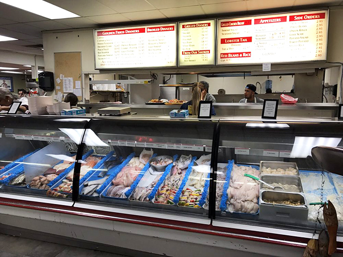 The seafood counter where dreams come true – fresh catches displayed with the pride of people who have been doing this dance for decades.