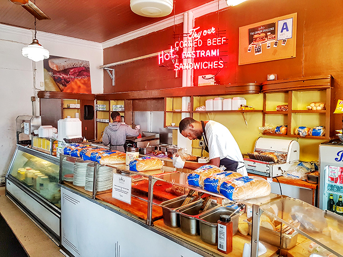 Where sandwich magic happens. Behind this counter, deli artisans practice a craft that's increasingly rare in our fast-food world.