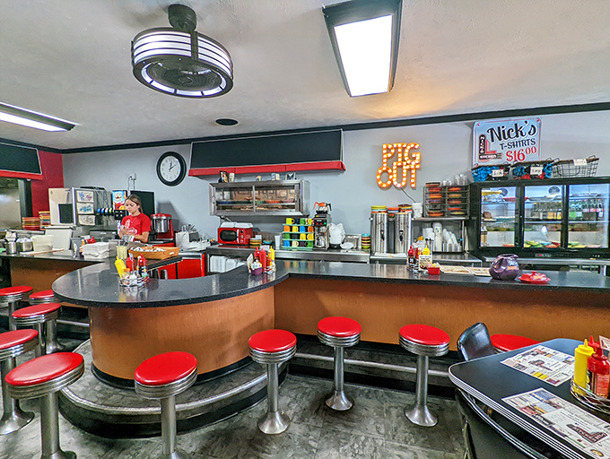 The counter at Nick's isn't just seating&mdash;it's front-row tickets to culinary theater, where breakfast dreams come true under those "PIG OUT" lights.