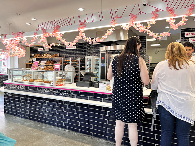 The counter's sleek design with festive cherry blossom decorations proves that serious baking can still have a sense of playful style.